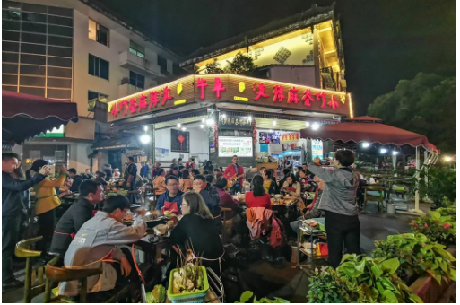 We both savour around the street snacks in Leshan with enough money ...